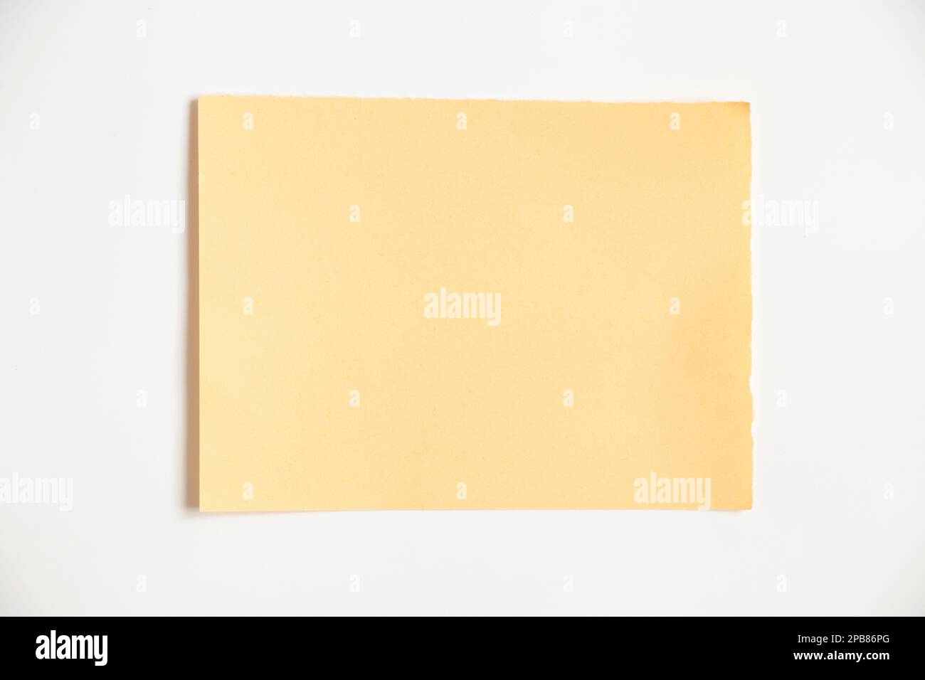 Yellow paper card isolated on white background Stock Photo - Alamy