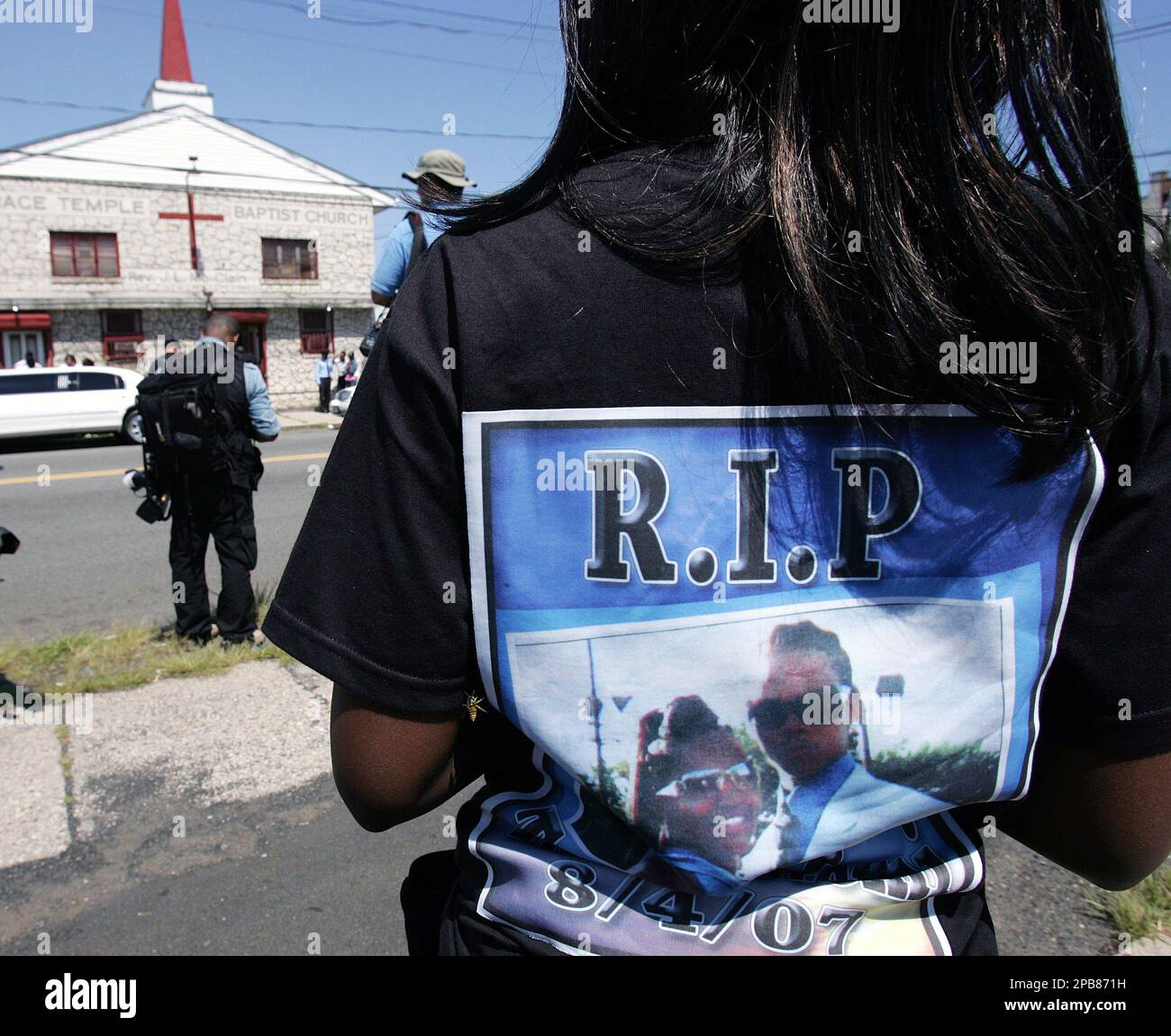Mecca Ali wears a shirt with a photograph of Iofemi Hightower, 20 and ...