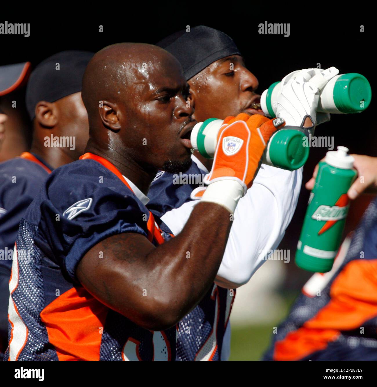 Denver Broncos safetys Steve Cargile, front, and Hamza Abdullah drink ...
