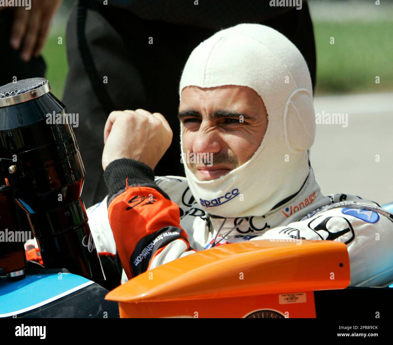 Dario Franchitti, of Scotland, gets into his car to practice for the ...