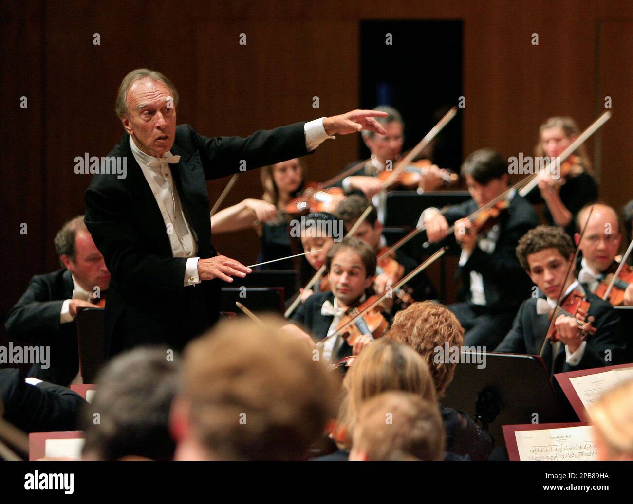 World famous Italian conductor Claudio Abbado, left, conducts his ...