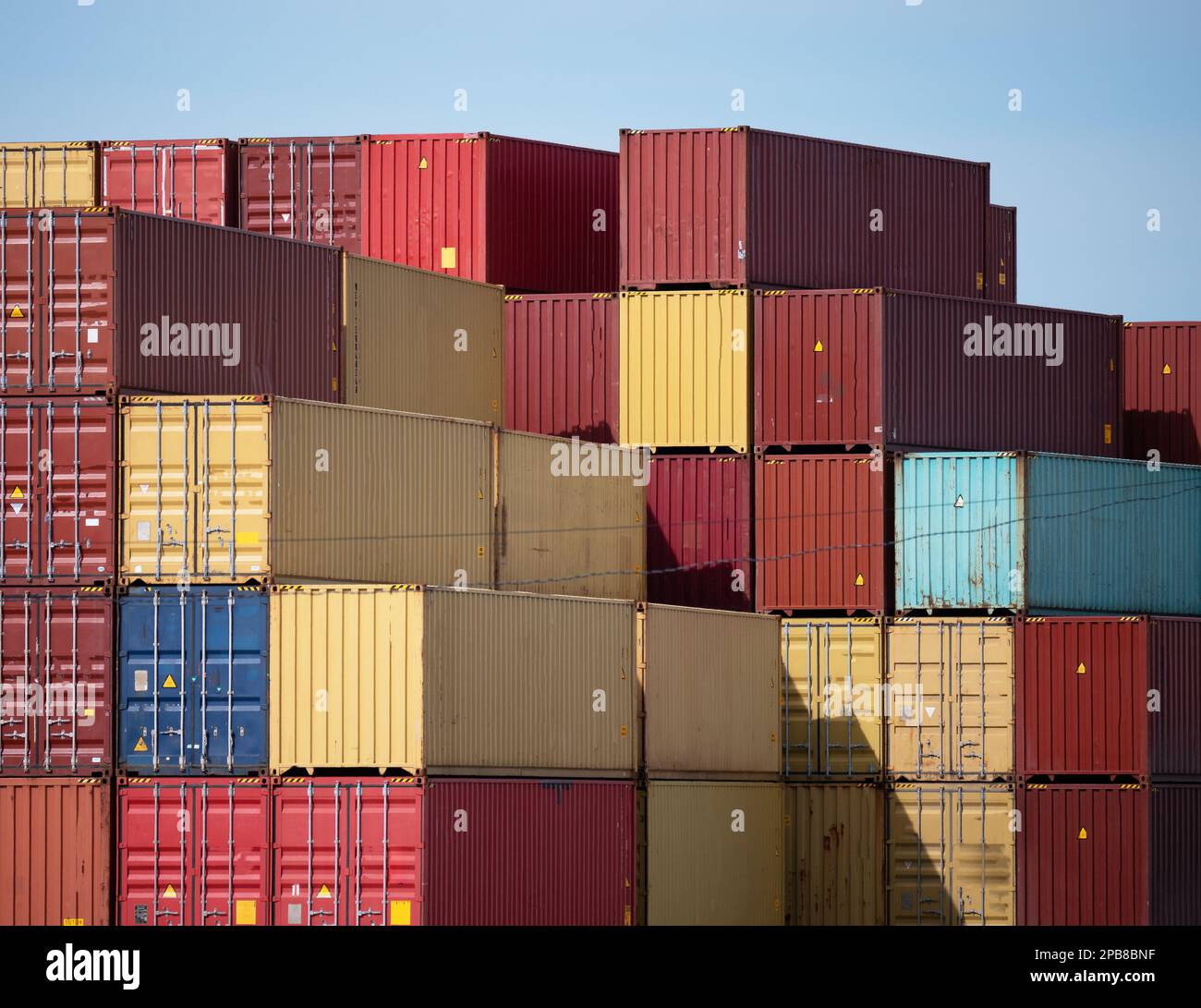Stacks of large iron cargo containers for transporting import and ...