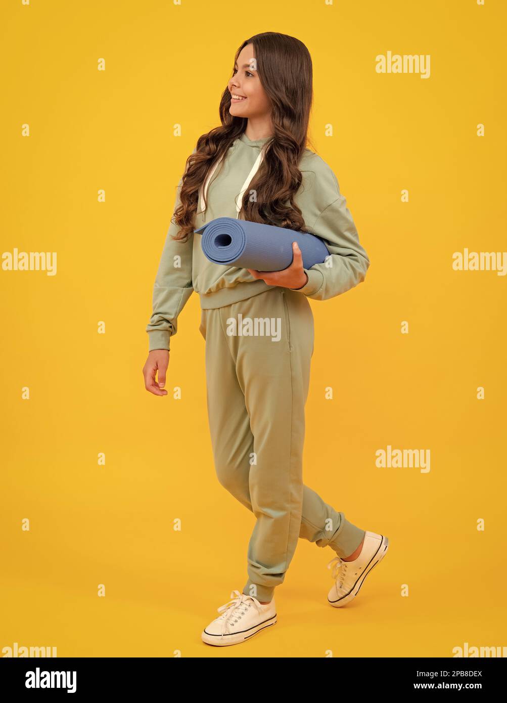 Child girl dressed in sports uniform. Child in a posh stylish sports ...