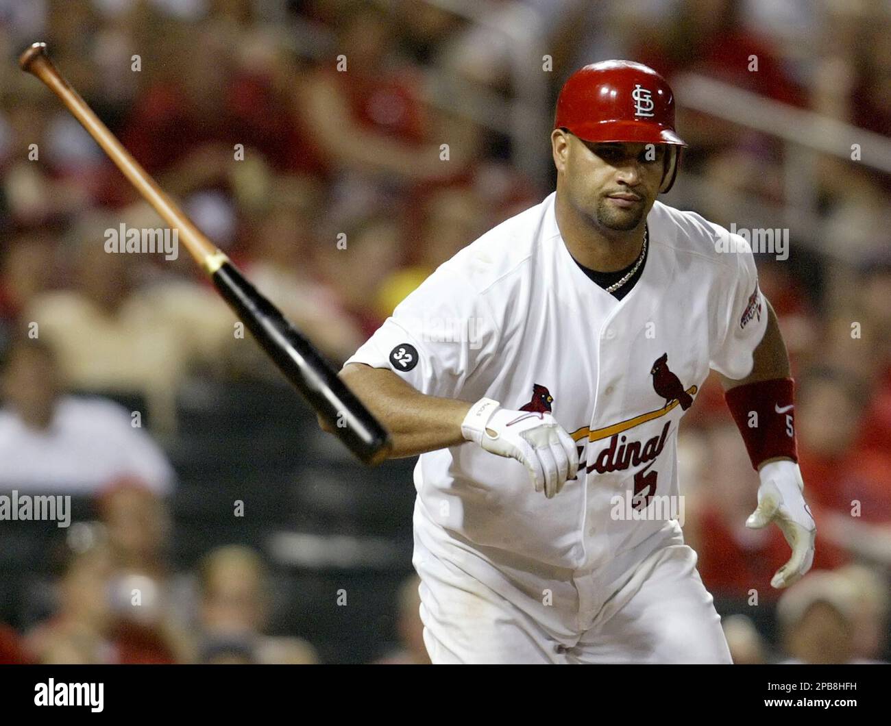 St. Louis Cardinals' Albert Pujols tosses his bat after being walked in ...
