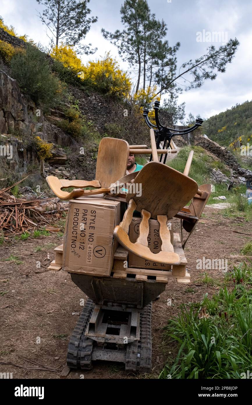 People involved in carpentry work at the eco-village of Loural in the ...