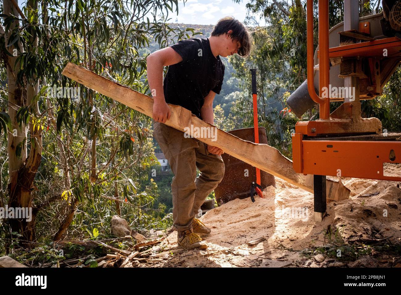 People involved in carpentry work at the eco-village of Loural in the ...