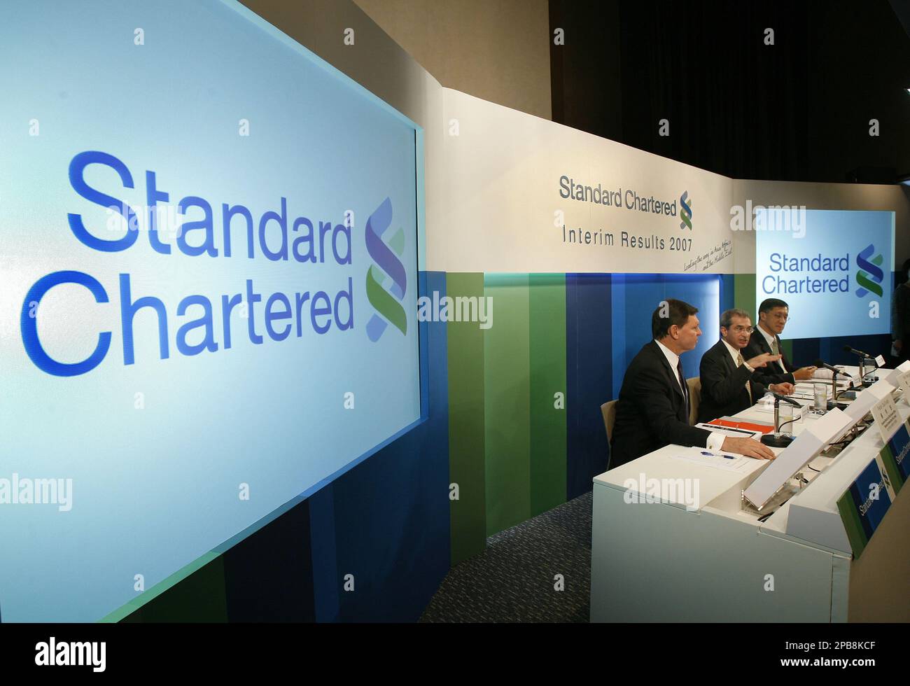 Kai Nargolwala, center, group executive director of Standard Chartered ...