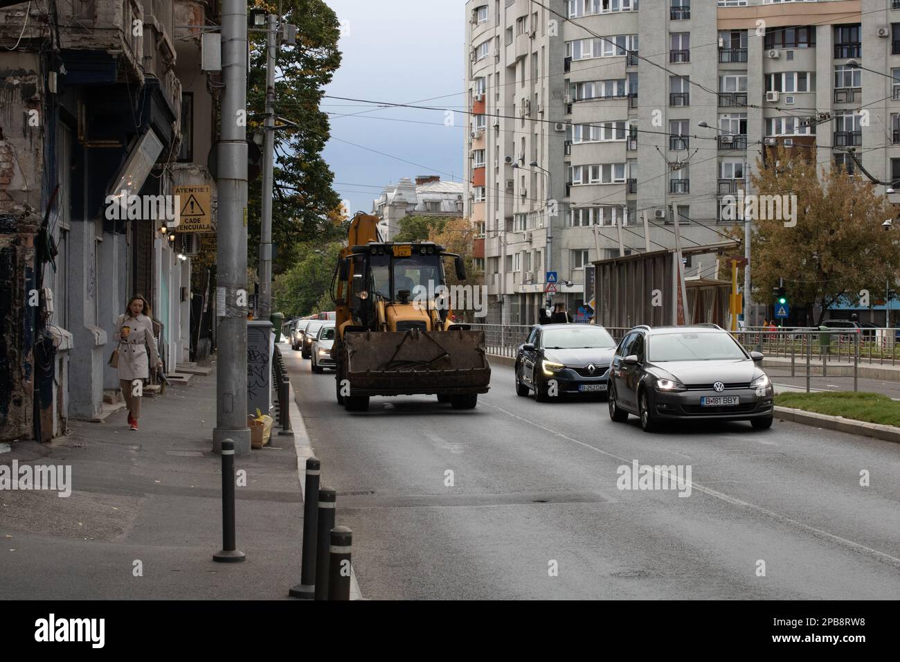Construction workers at construction site and heavy duty bulldozer in ...