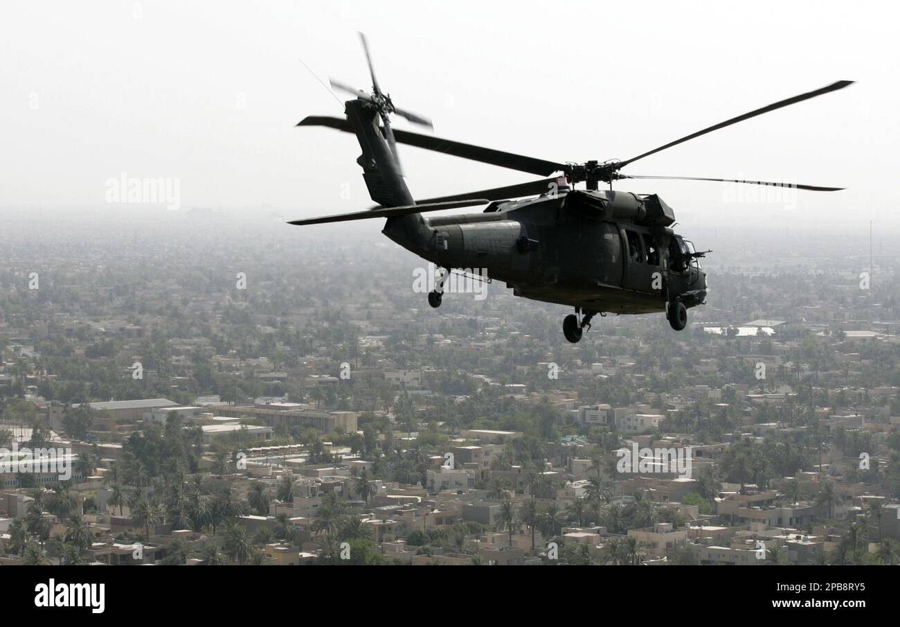 U.S. military helicopter flies over Baghdad, Iraq on Sunday, Aug. 5 ...