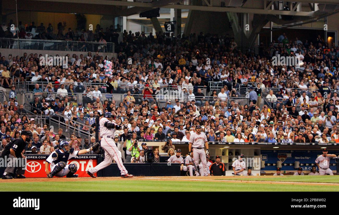 The ball takes flight as San Francisco Giants' Barry Bonds swings on ...