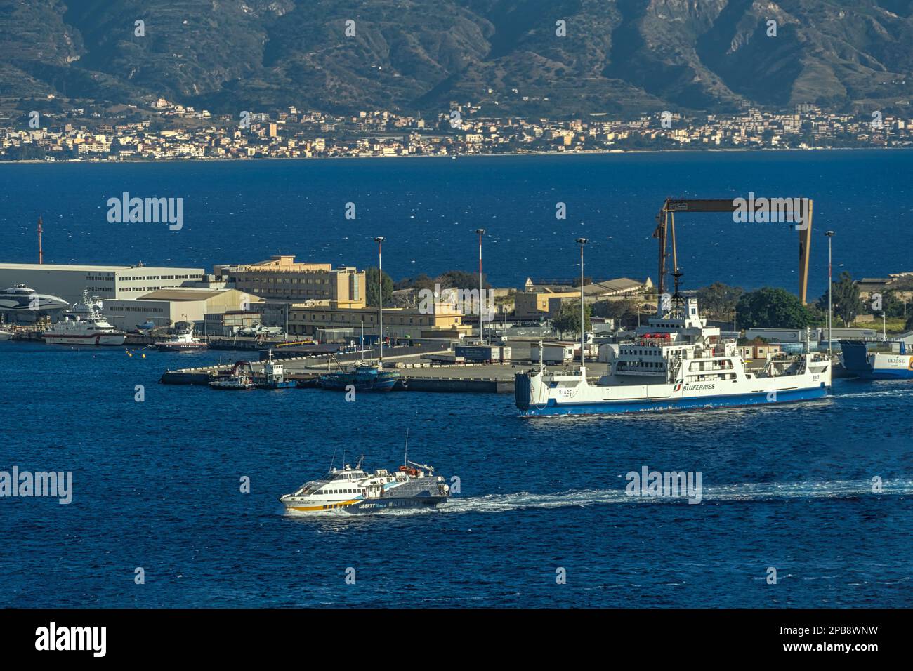Port of Messina, ferries at the pier and departing ferries. In the ...