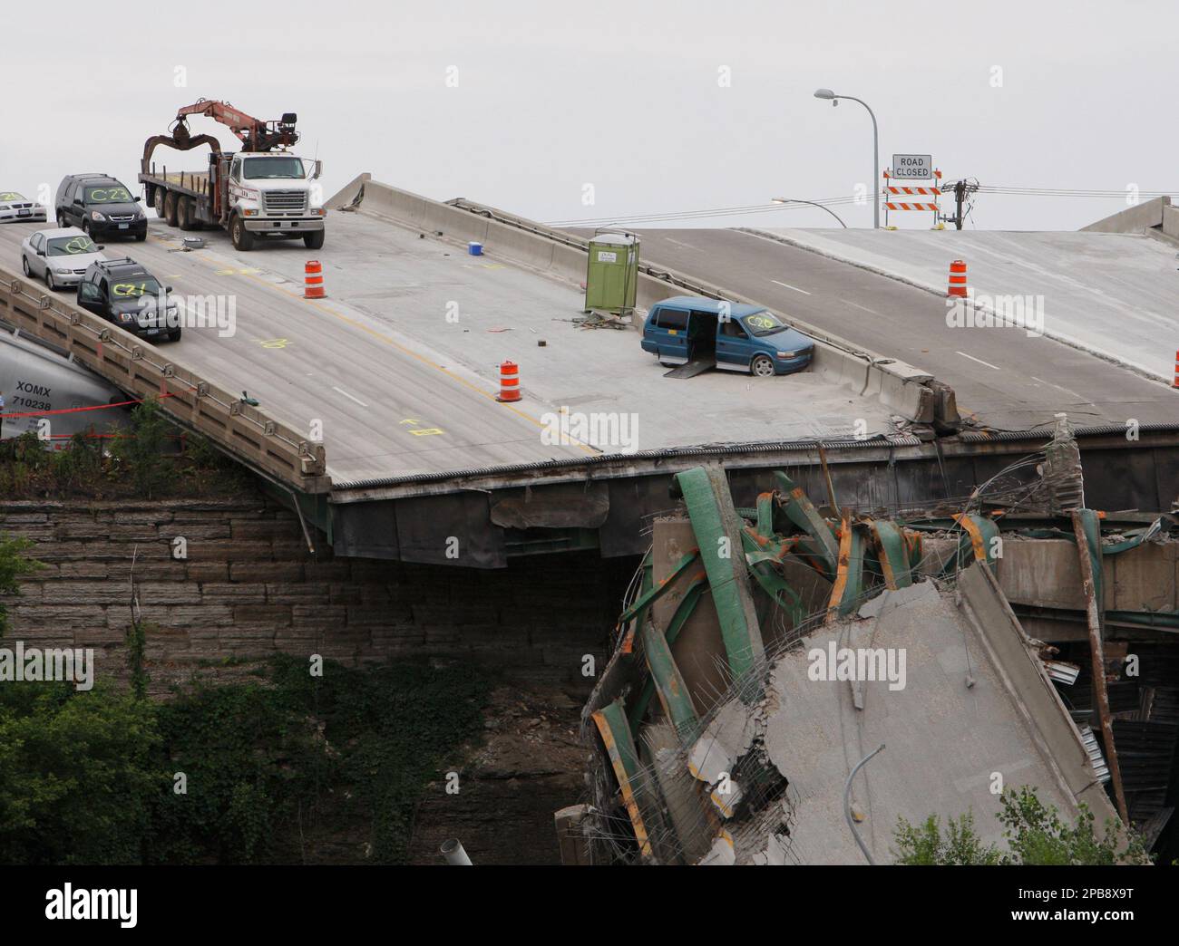 Abandoned vehicles remain as President Bush, not pictured, tours the ...