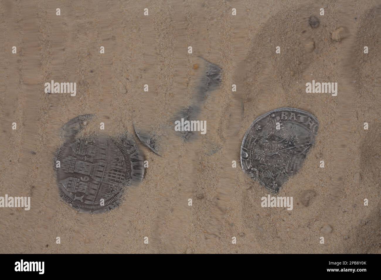 coin in sand under the water background Stock Photo - Alamy