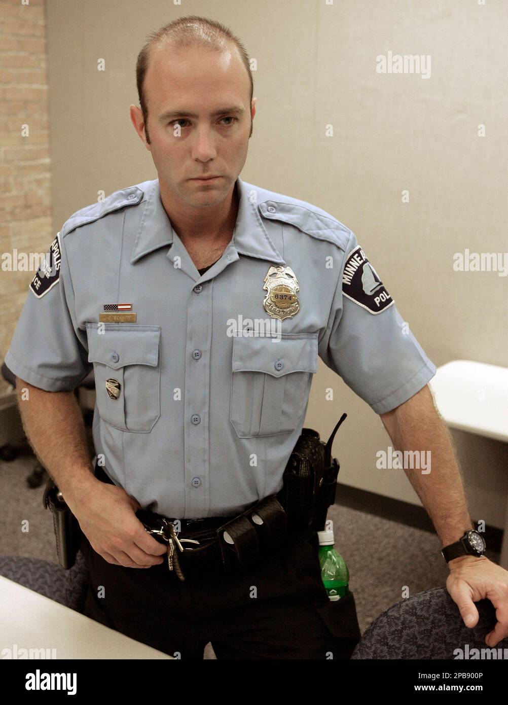Minneapolis police officer Jay Schmitt pauses for a moment as he talks ...