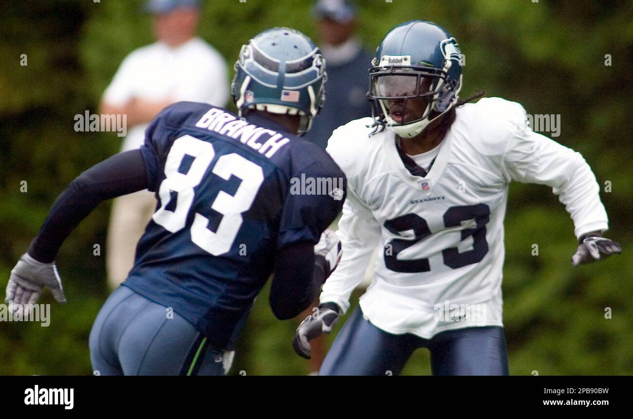 Seattle Seahawks cornerback Marcus Trufant, right, defends wide ...