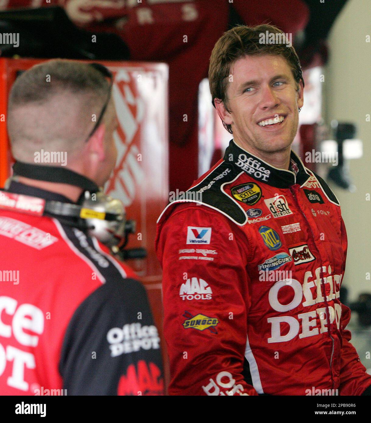 NASCAR driver Carl Edwards smiles after practice for Sunday's NASCAR Pennsylvania 500 auto ...