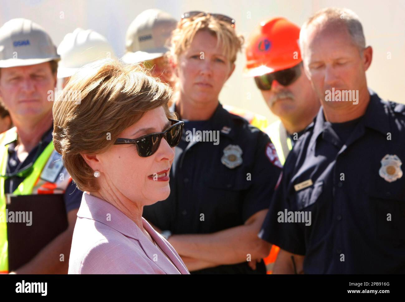 First lady Laura Bush talks to first responders as she visits the site ...