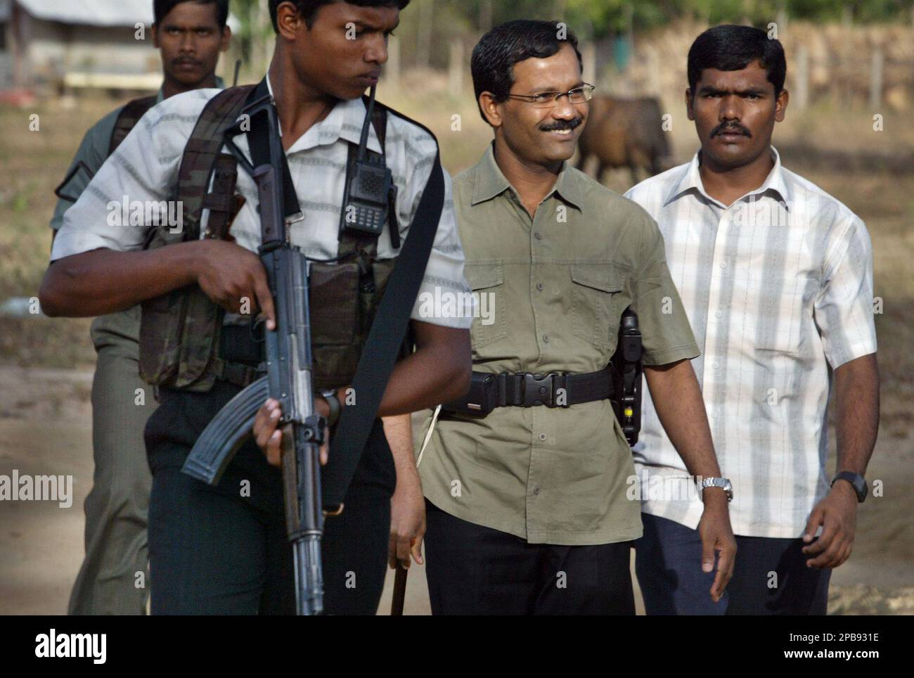 S.P. Tamilselvam, second right, head of the political wing of ...