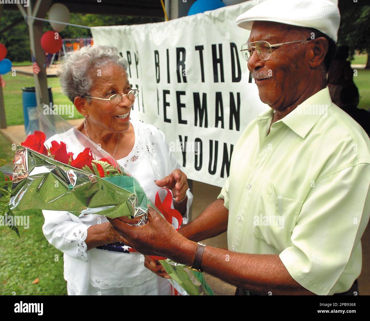Retired schoolteacher Etta Freeman receives a dozen red roses from her ...