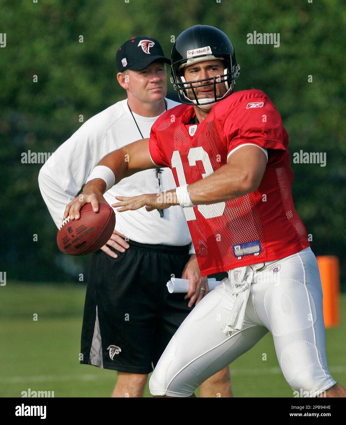 Atlanta Falcons quarterback Joey Harrington throws as head coach Bobby ...