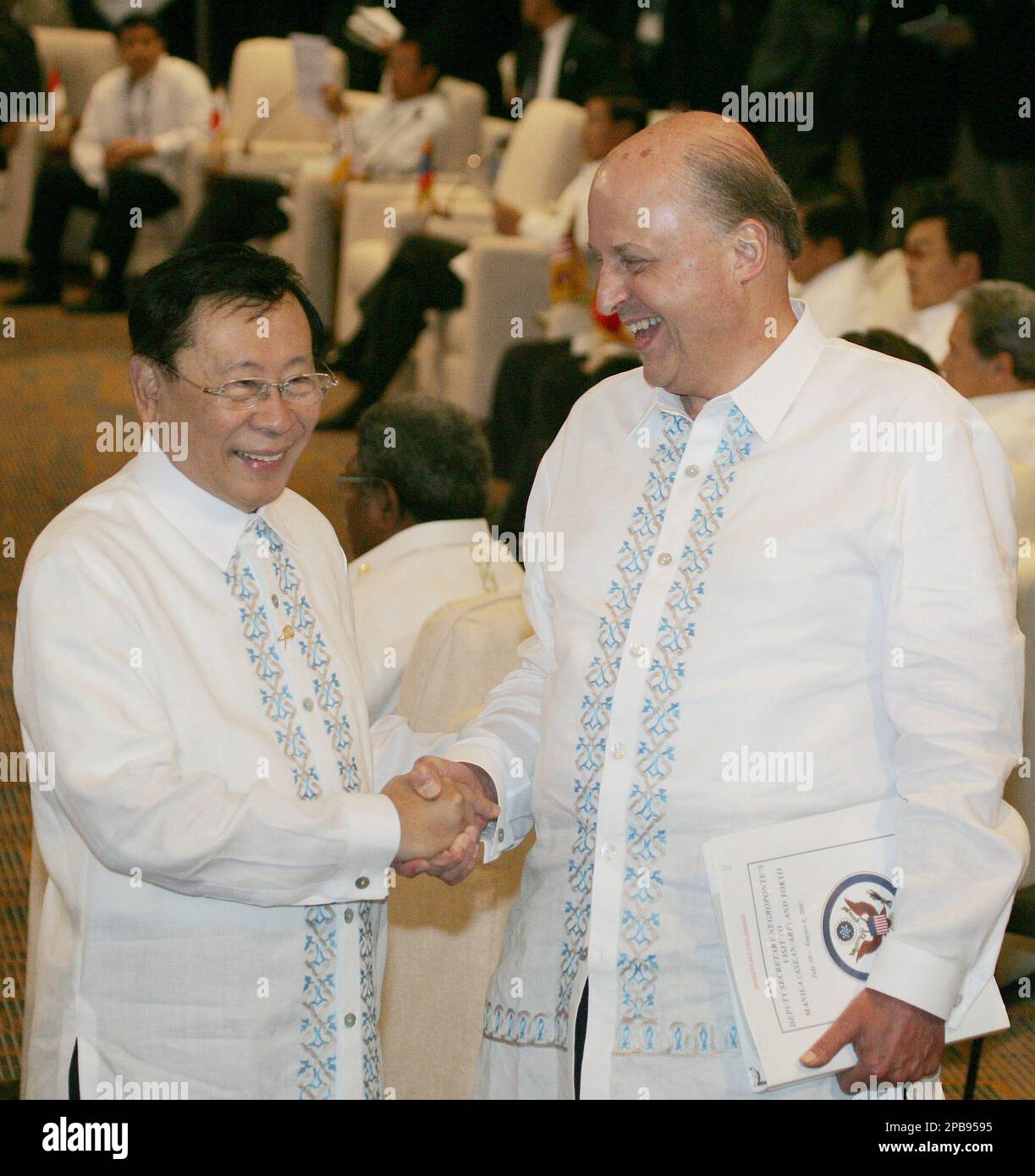 Philippine Foreign Secretary Alberto Romulo, left, welcomes US Deputy ...