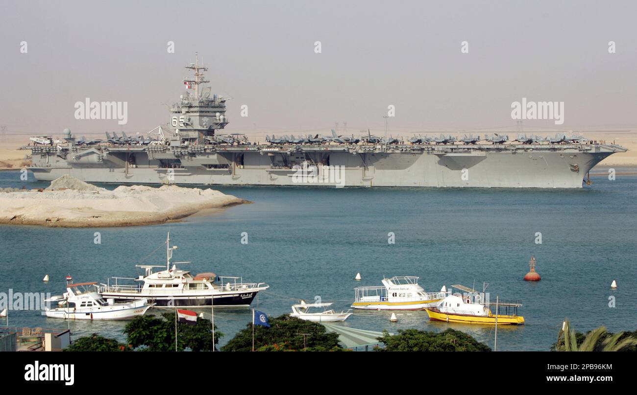 The USS Enterprise passes through the Suez canal in the city of Suez in ...