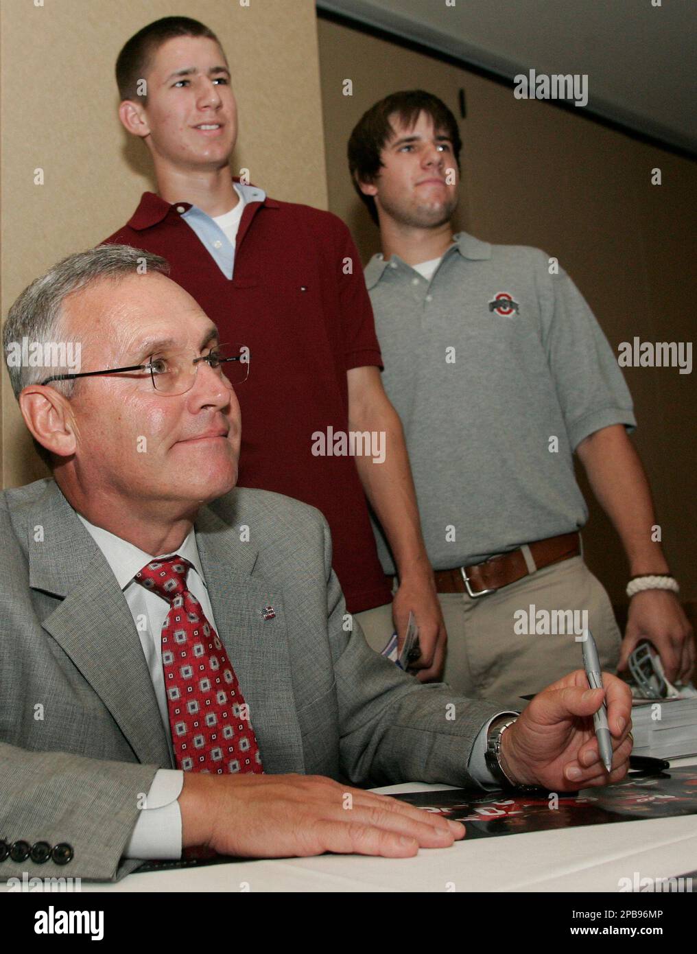 Ohio State Buckeyes football coach Jim Tressel, left, poses for a photo ...