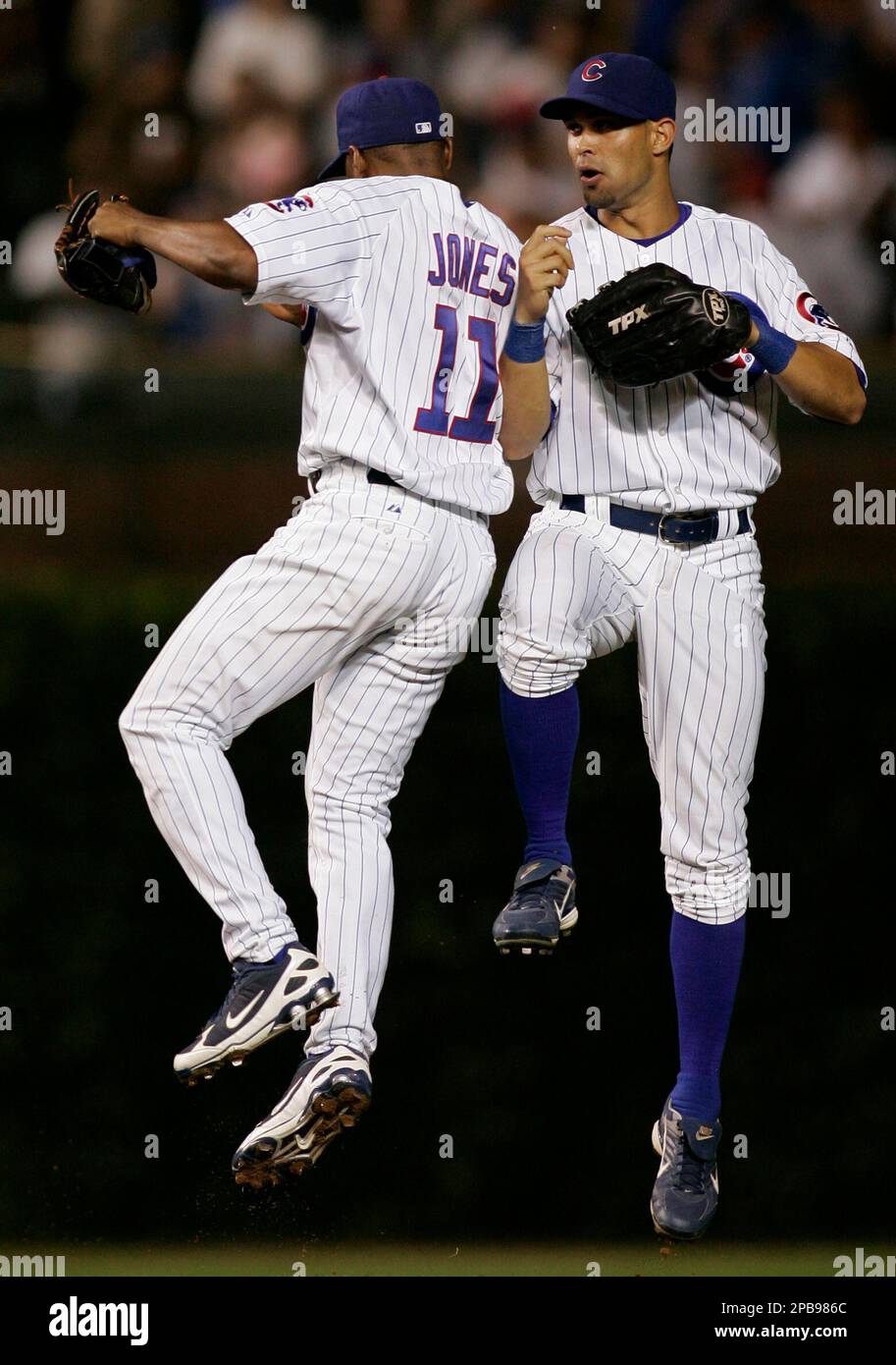 Chicago Cubs' Angel Pagan, right, celebrates with Jacque Jones (11 ...