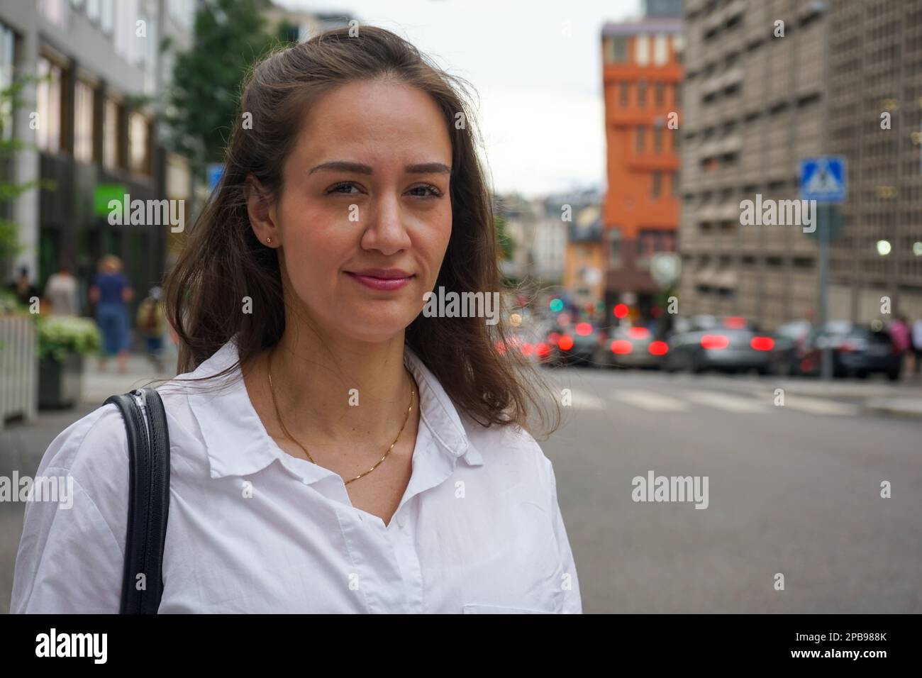 Woman standing on street in hi-res stock photography and images - Alamy