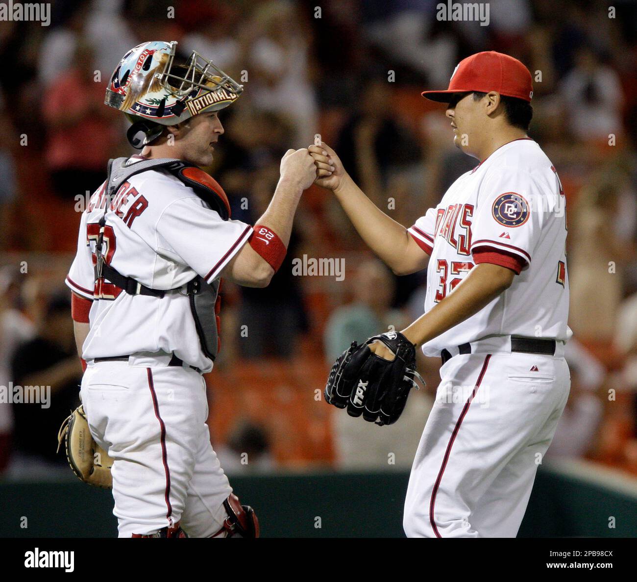 Washington Nationals pitcher Chad Cordero, right, is congratulated by ...