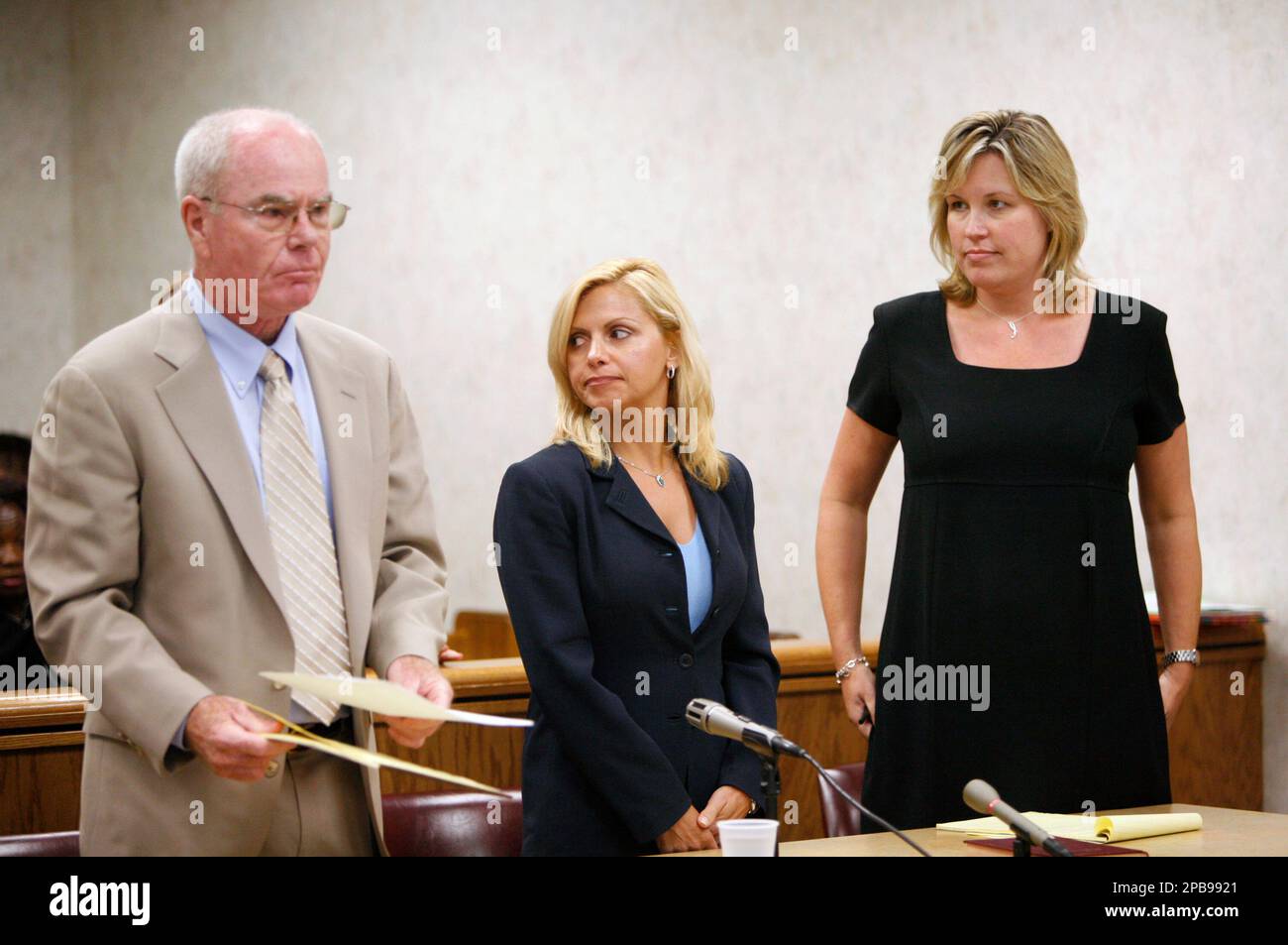 Dina Matos McGreevey, center, glances towards her husband, former New ...