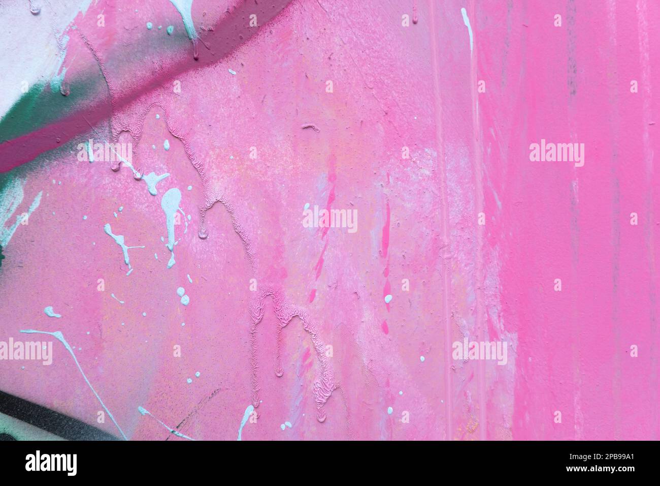 Messy paint strokes and smudges on an old painted wall. Colorful drips ...