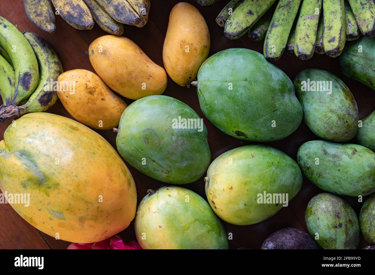 Set of Balinese fruits and vegetables. Banana, dragon fruit, mango ...