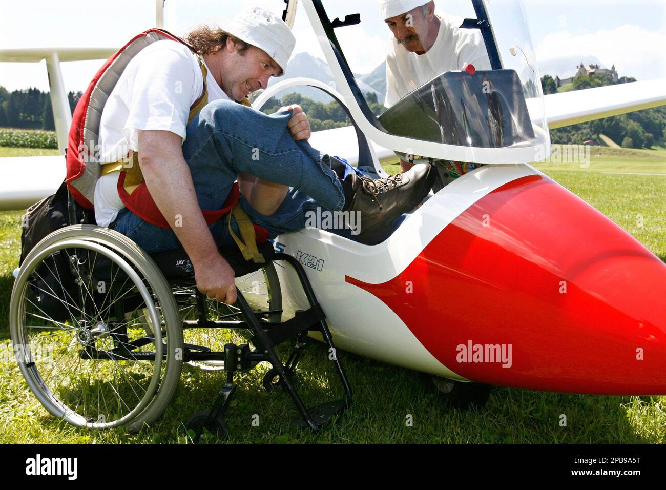 British wheelchair user, pilot David Tuttle, gets into his glider prior ...