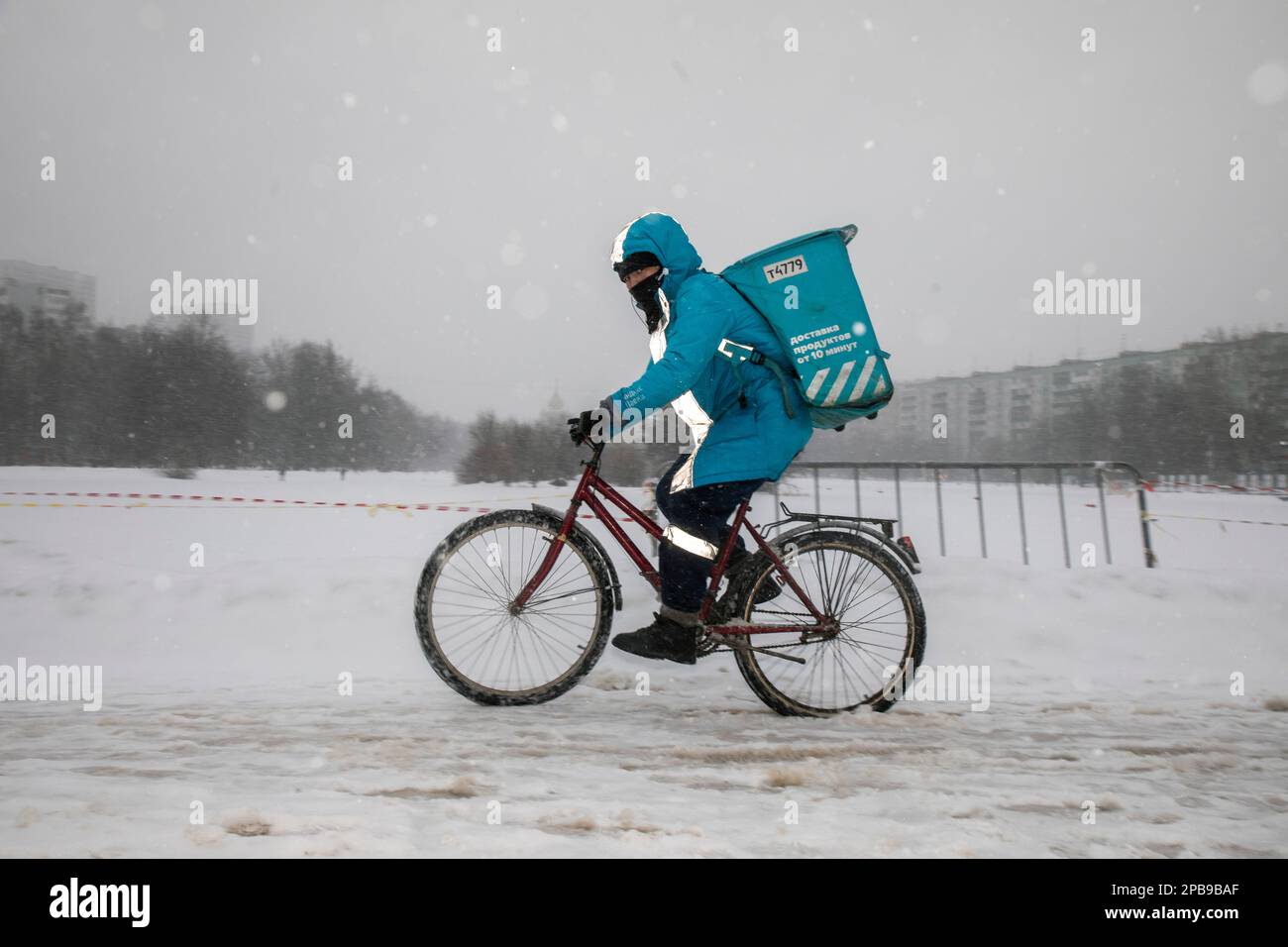 Moscow, Russia. 12th March, 2023. A courier of the Yandex Lavka ...