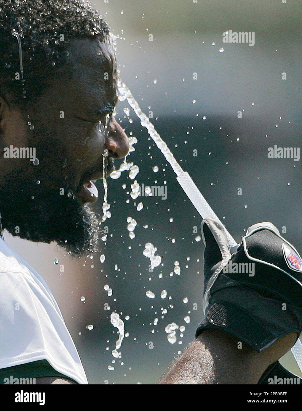 Green Bay Packers' Ryan Pickett tries to cool off during football ...