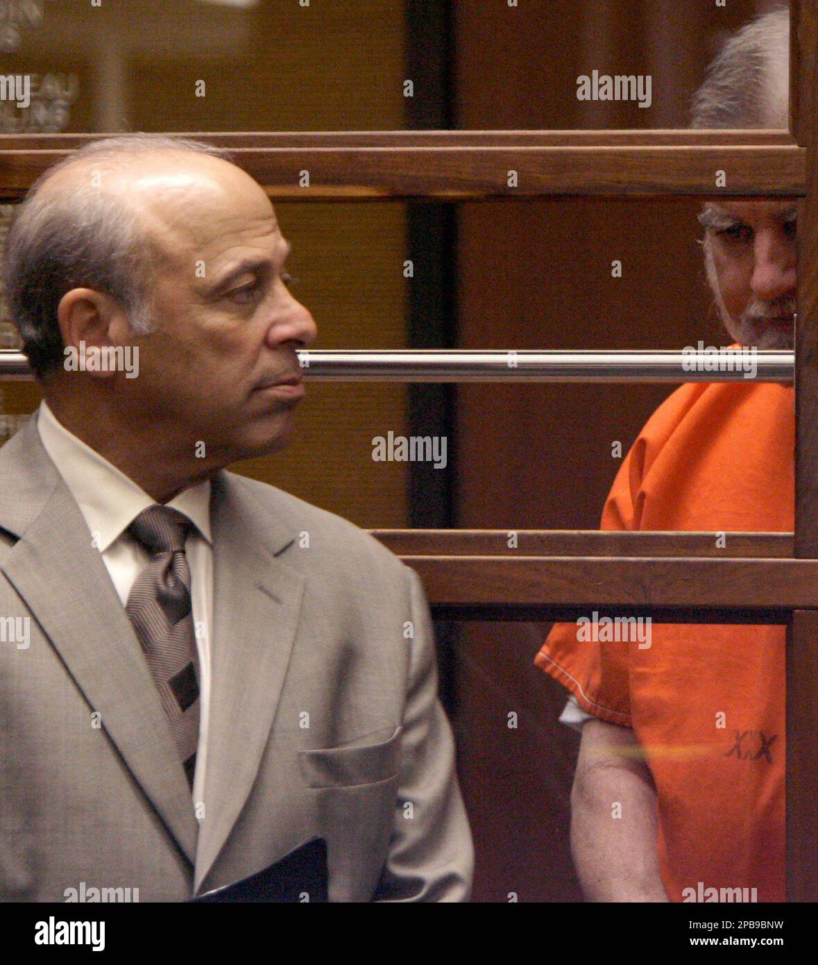 Former Roman Catholic priest Michael Stephen Baker, right, shown behind ...