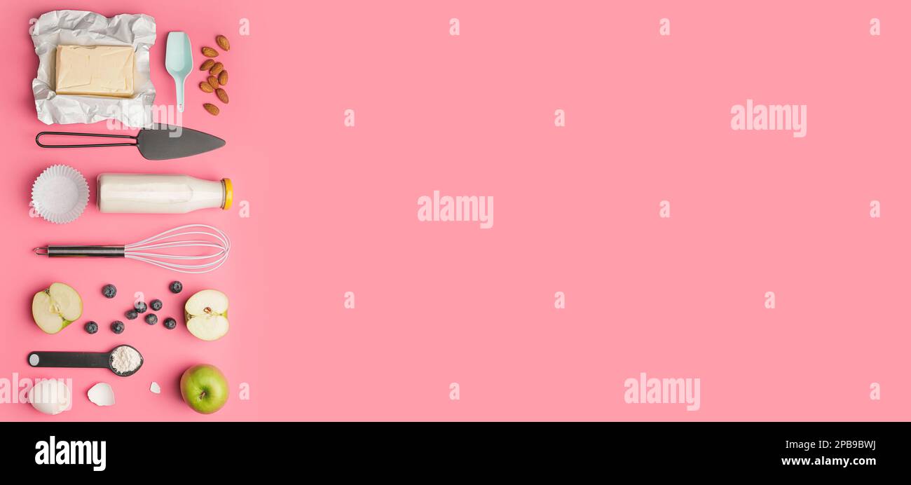 Ingredients for preparing bakery and utensils on pink background with ...