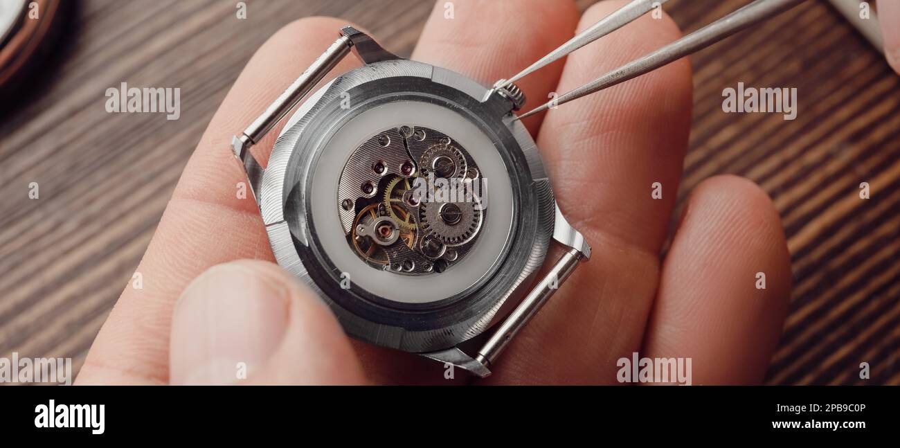 Person repairing clock hi-res stock photography and images - Alamy