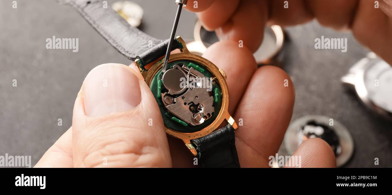 Person repairing clock hi-res stock photography and images - Alamy
