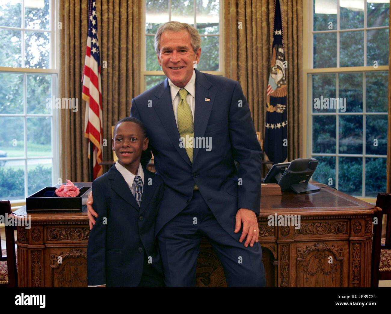 President Bush, right, meets with, Ezekiel "Zeek" Taylor, 7, of Durham ...