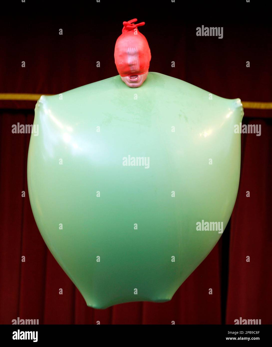 Mr. Toons leaps into the air inside an enormous balloon during the ...