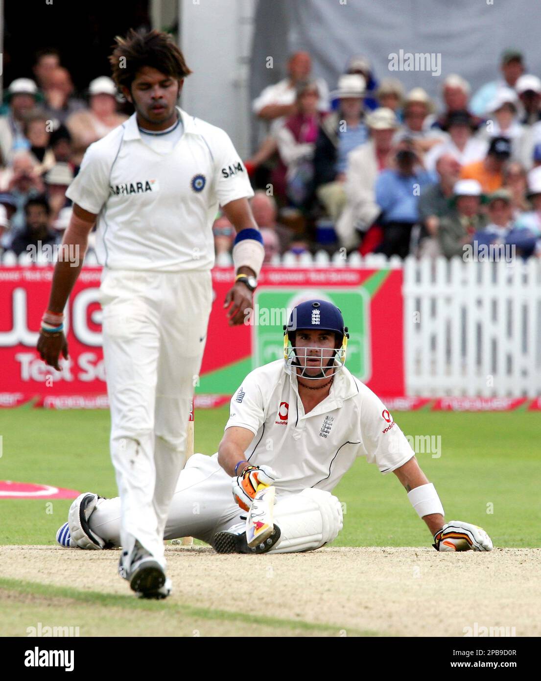 England's Kevin Pietersen, right, ducks under a ball from India's ...