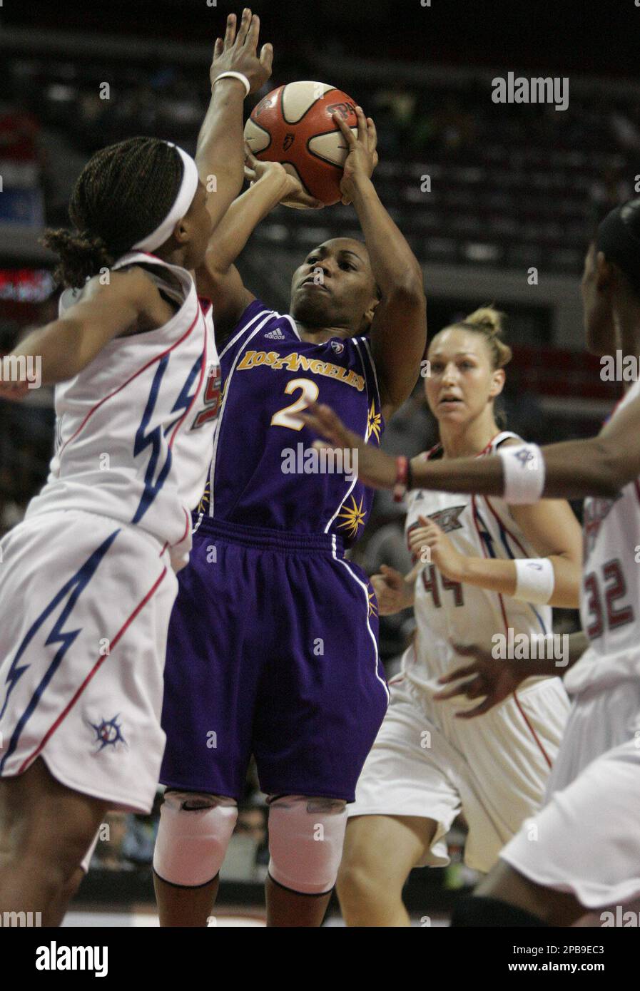Los Angeles Sparks' Temeka Johnson (2) takes a shot over Detroit Shock ...