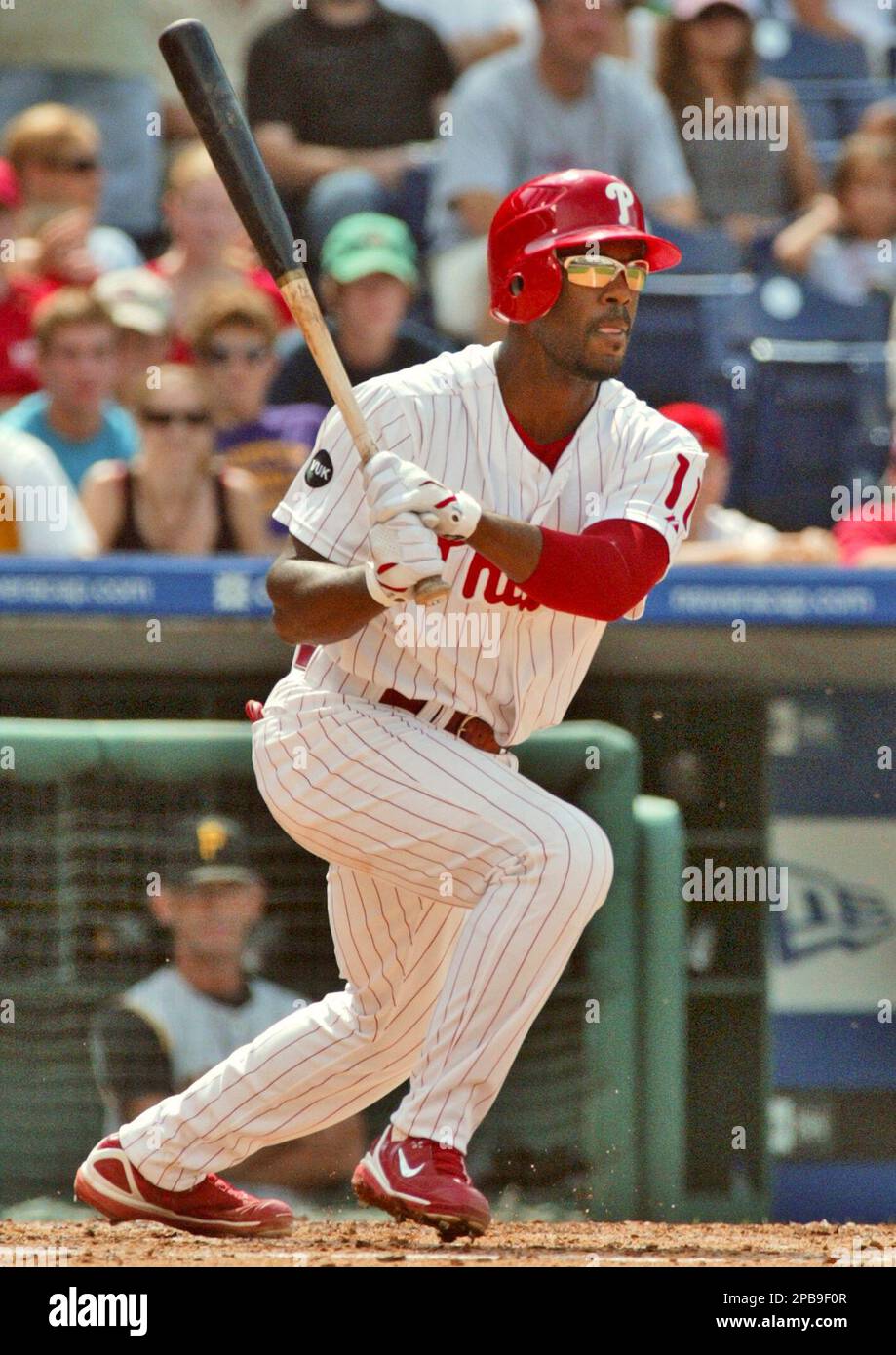 Philadelphia Phillies' Jimmy Rollins hits a triple against the ...