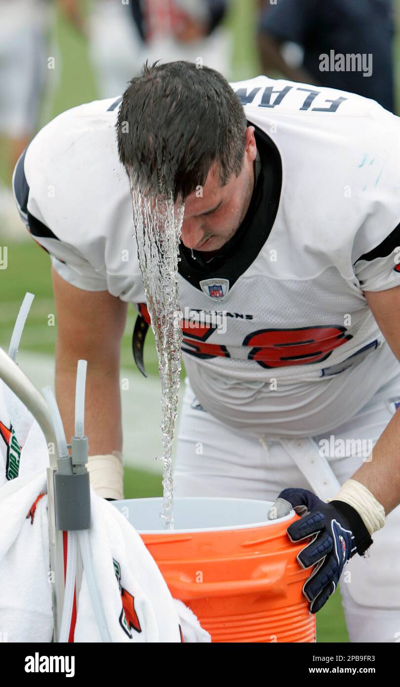 Houston Texans center Mike Flanagan pulls his head up after dunking ...