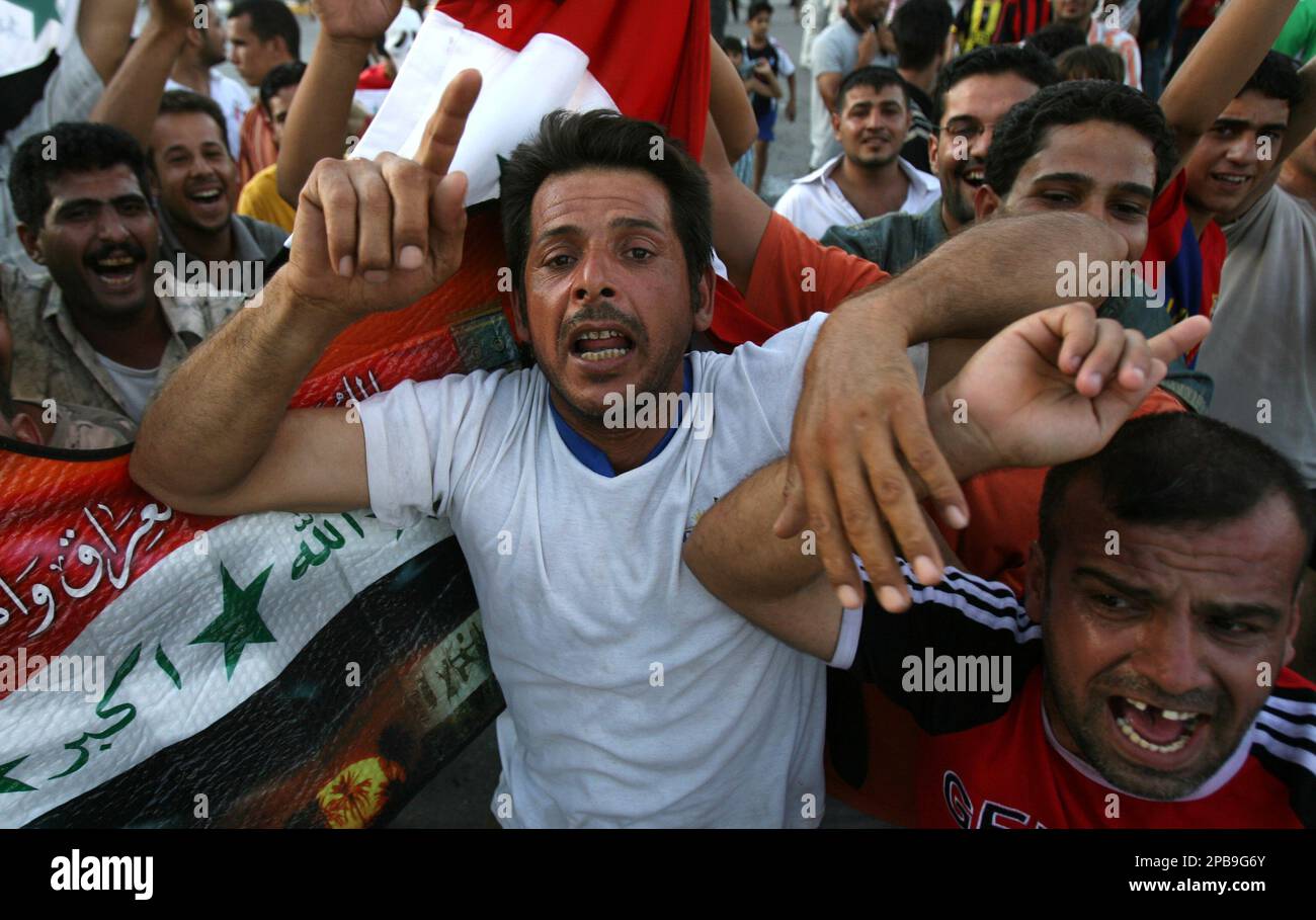 Iraqi people celebrate in streets of central Baghdad, Iraq, Sunday ...