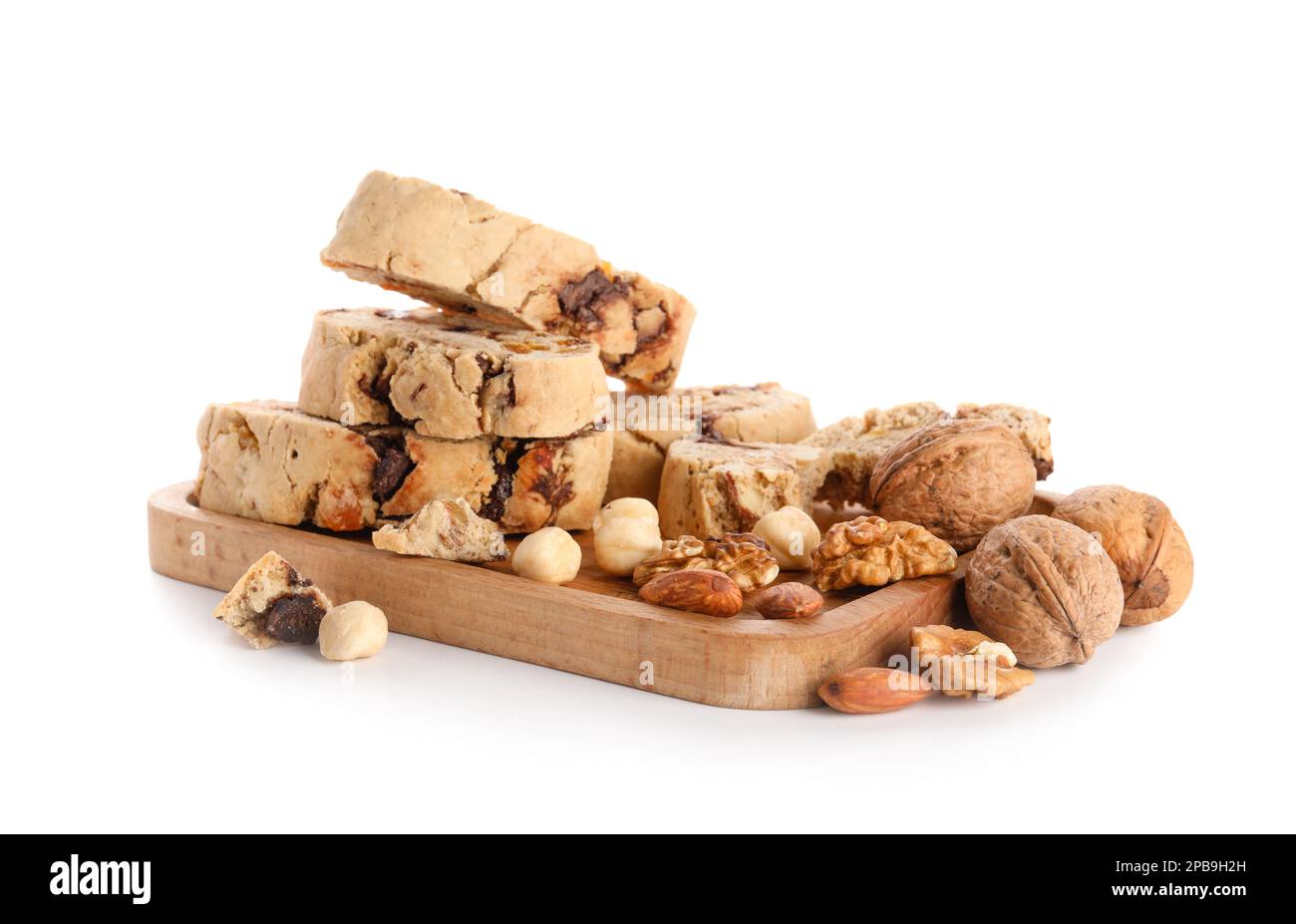 Board with delicious biscotti cookies and nuts isolated on white ...