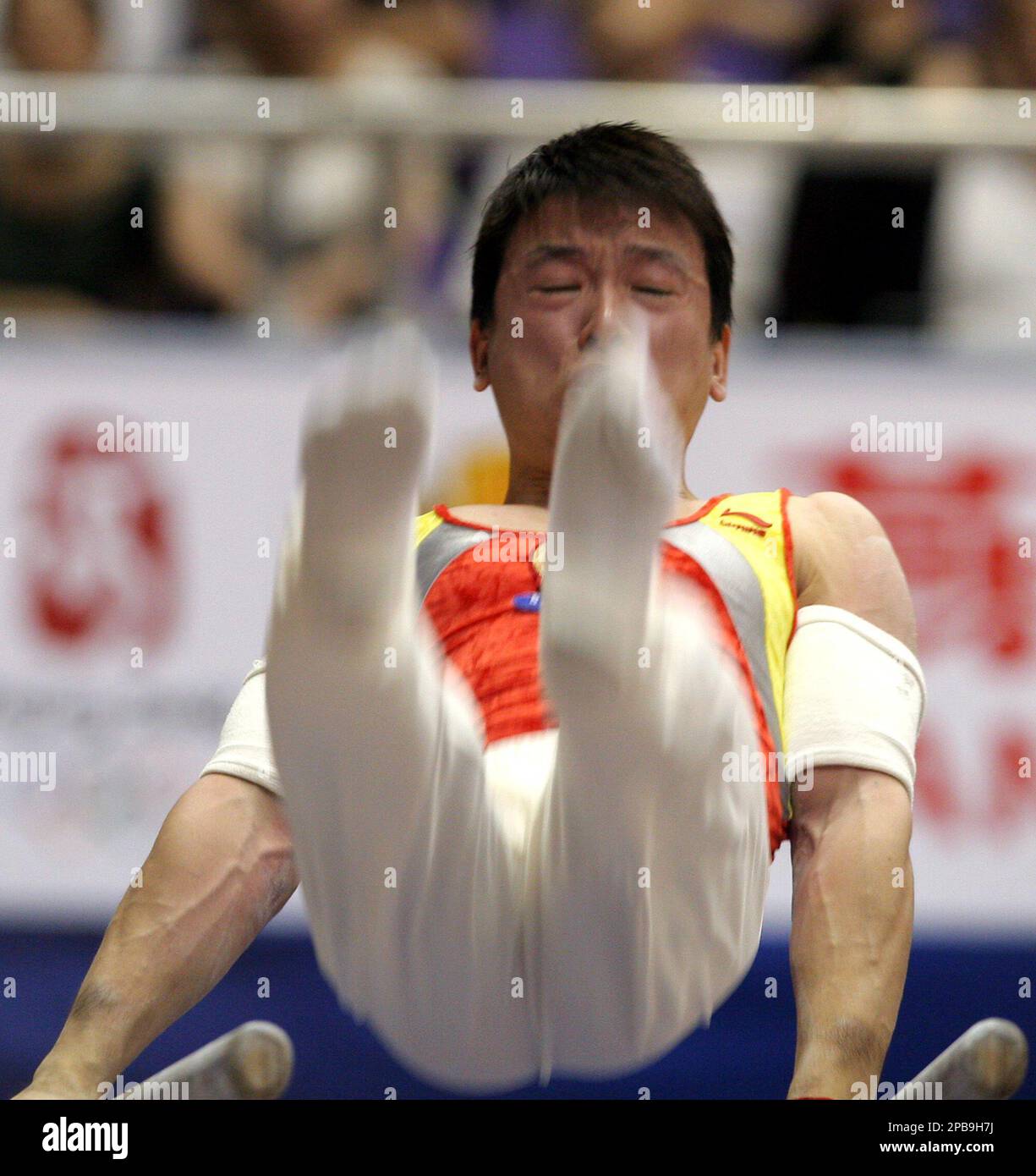 China's Huang Xu performs to win the silver medal in the parallel bars event at the World Cup ...