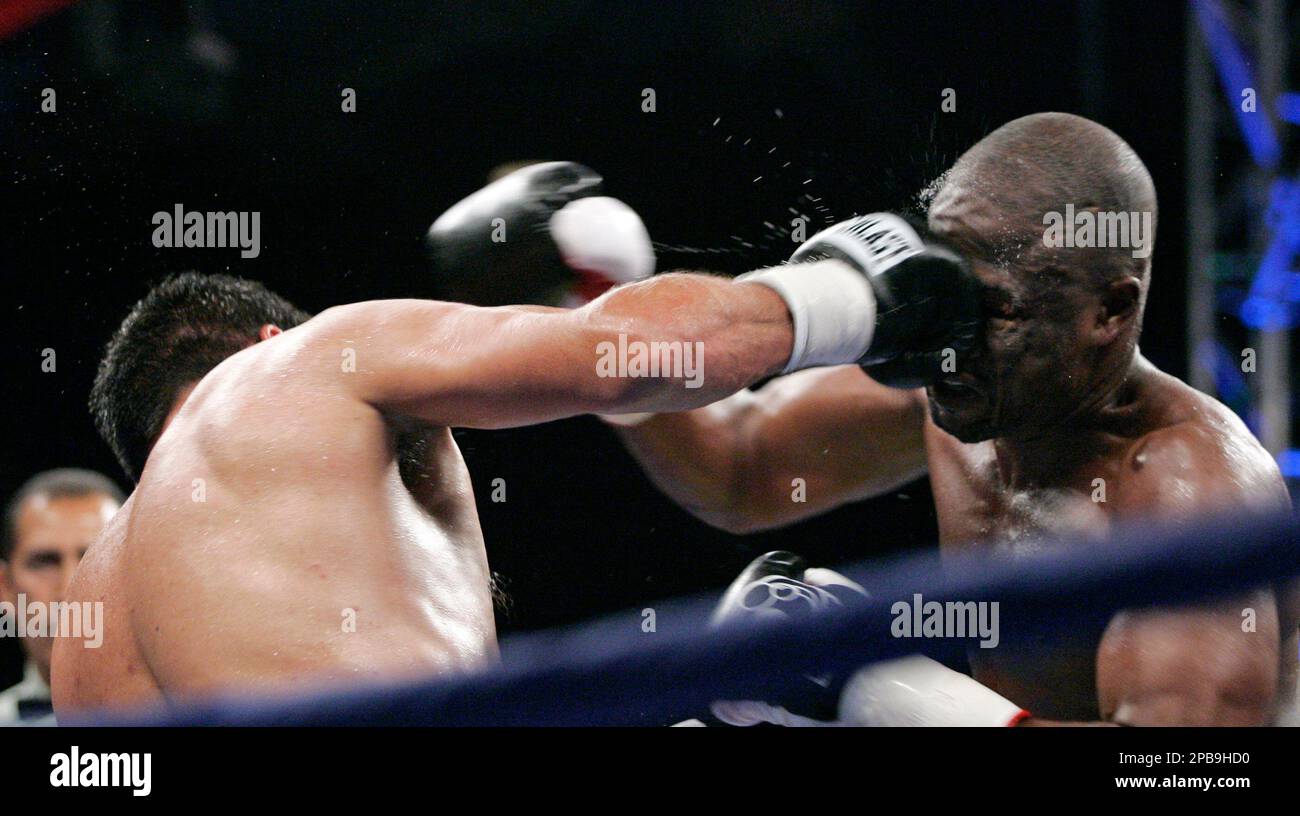 Carlos Baldomir, of Argentina, left, connects with a right to Vernon ...